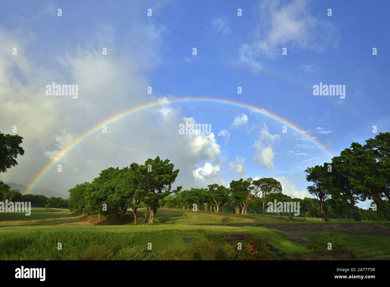 Scenic shot of the golf course with the rainbow across the sky Stock ...