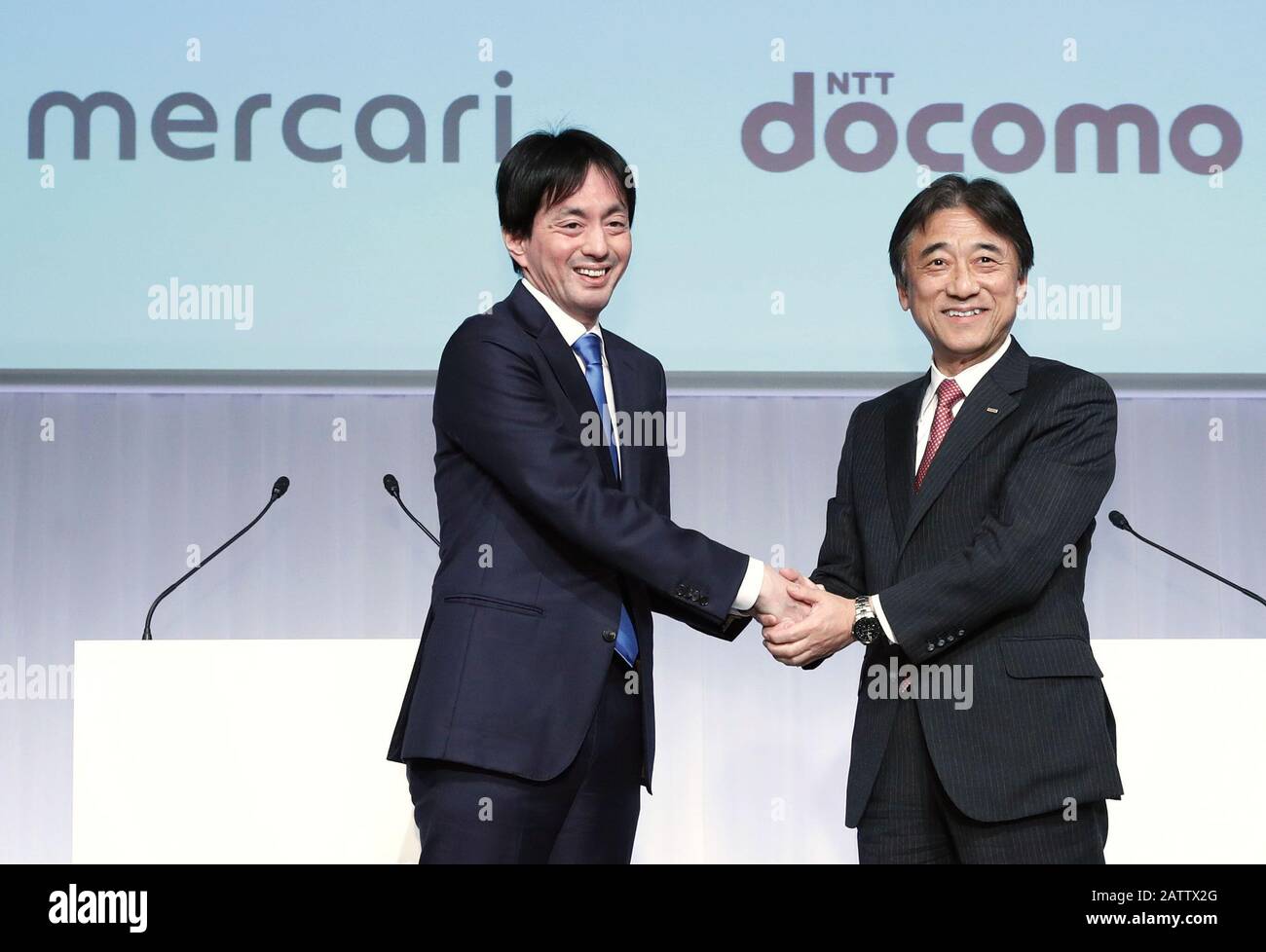 NTT Docomo Inc. President Kazuhiro Yoshizawa (R) and Shintaro Yamada ...