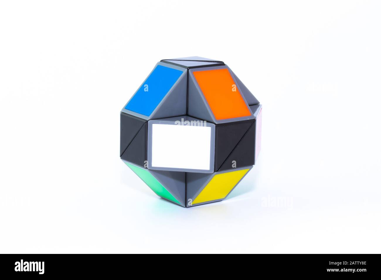 Toy colorful snake puzzle in shape of ball on white background Stock ...