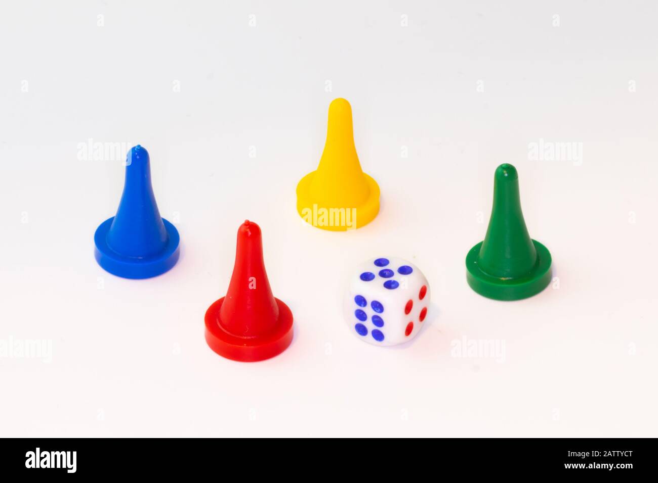Four tokens with dice on white background Stock Photo - Alamy