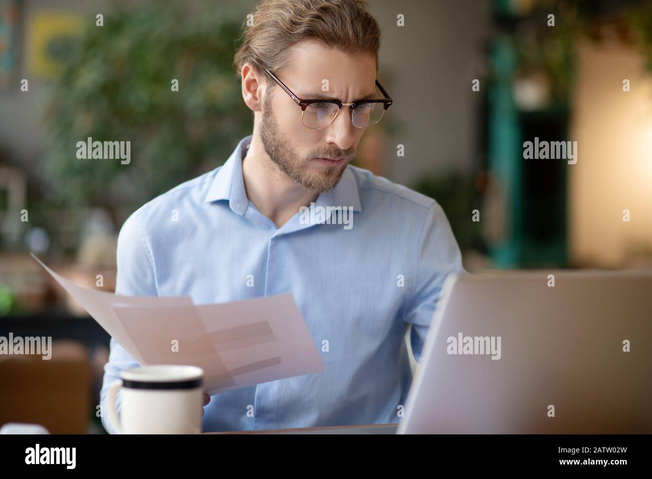 Carefully looking at screen hi-res stock photography and images - Alamy