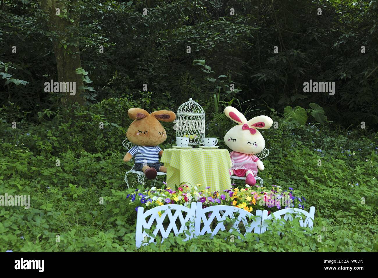Rabbits doll sitting on the garden Stock Photo - Alamy
