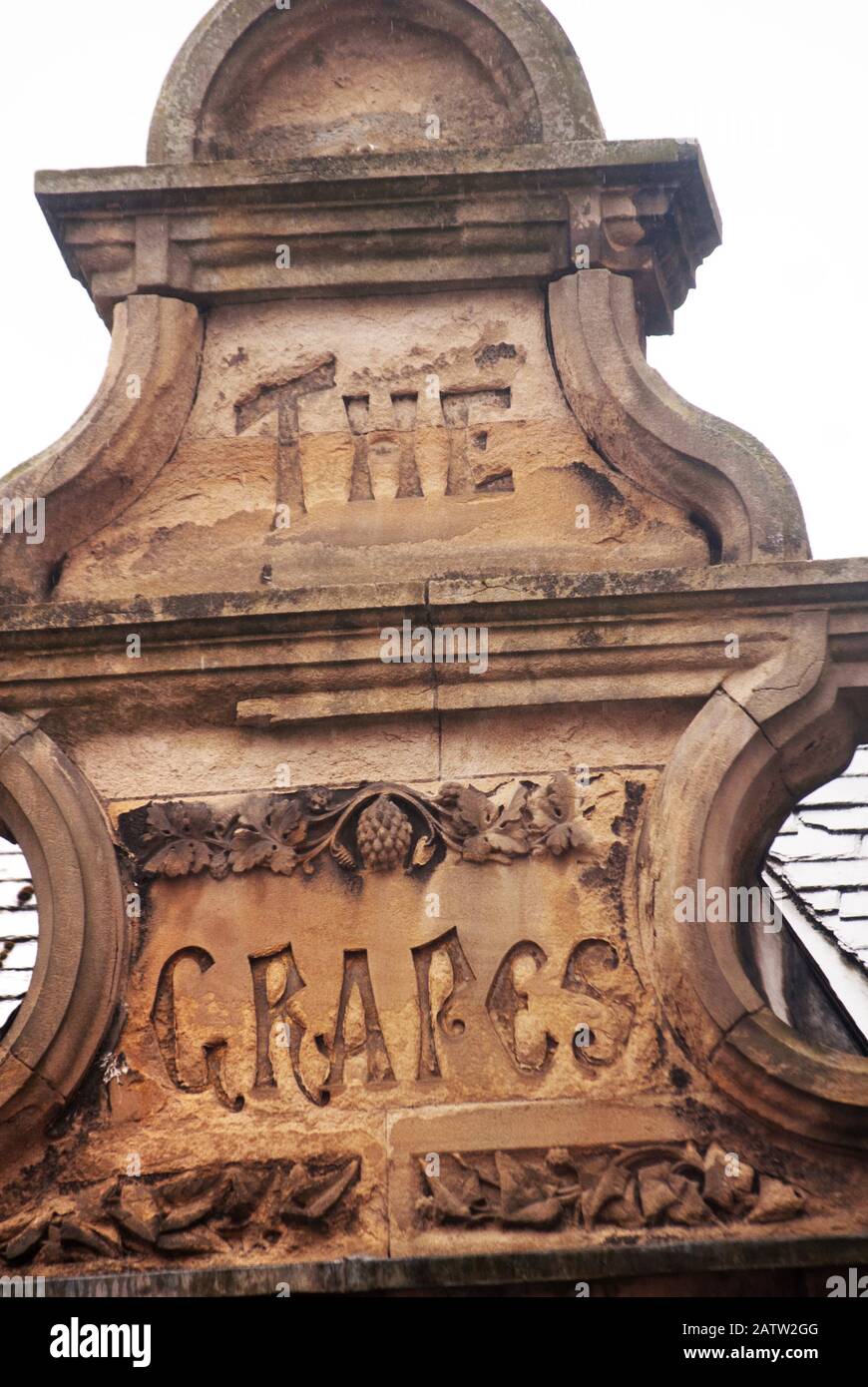 Ornate name sign on roof of The Grapes pub, Hexham, Northumberland ...