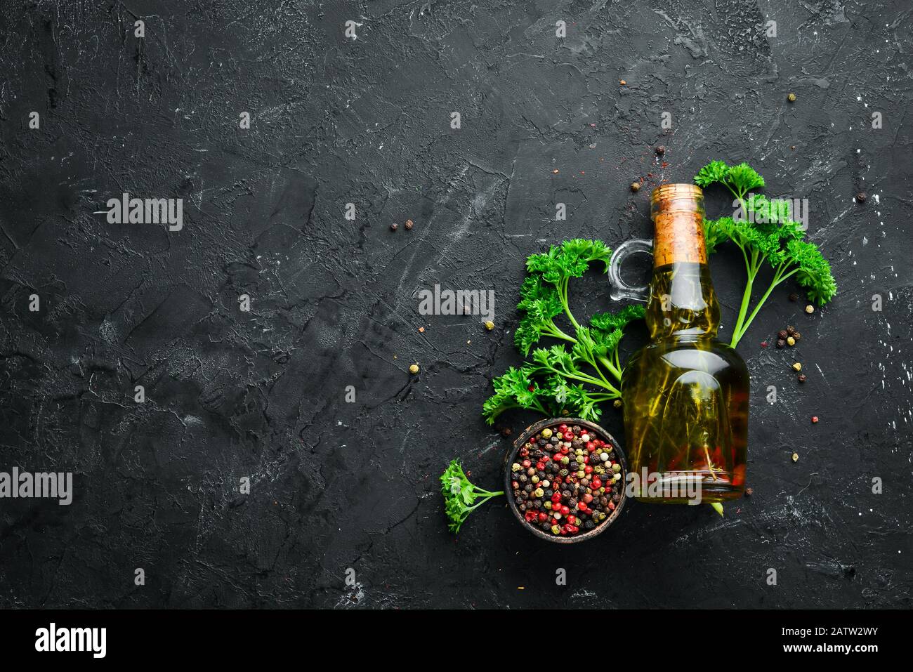 Smoked meat with spices and herbs. On a black wooden background. Top ...