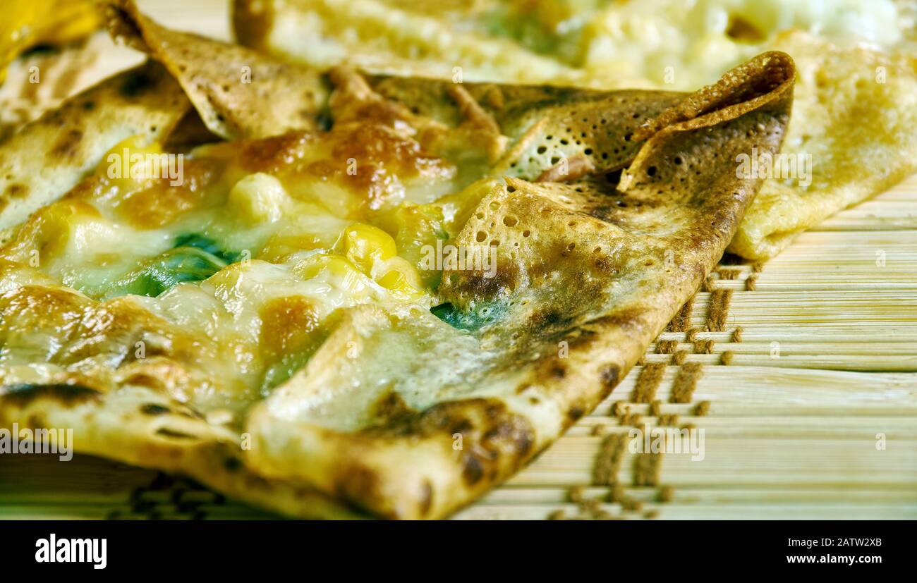 Zanzibar pizza, crispy pancakes with as many meats, sweets, or ...