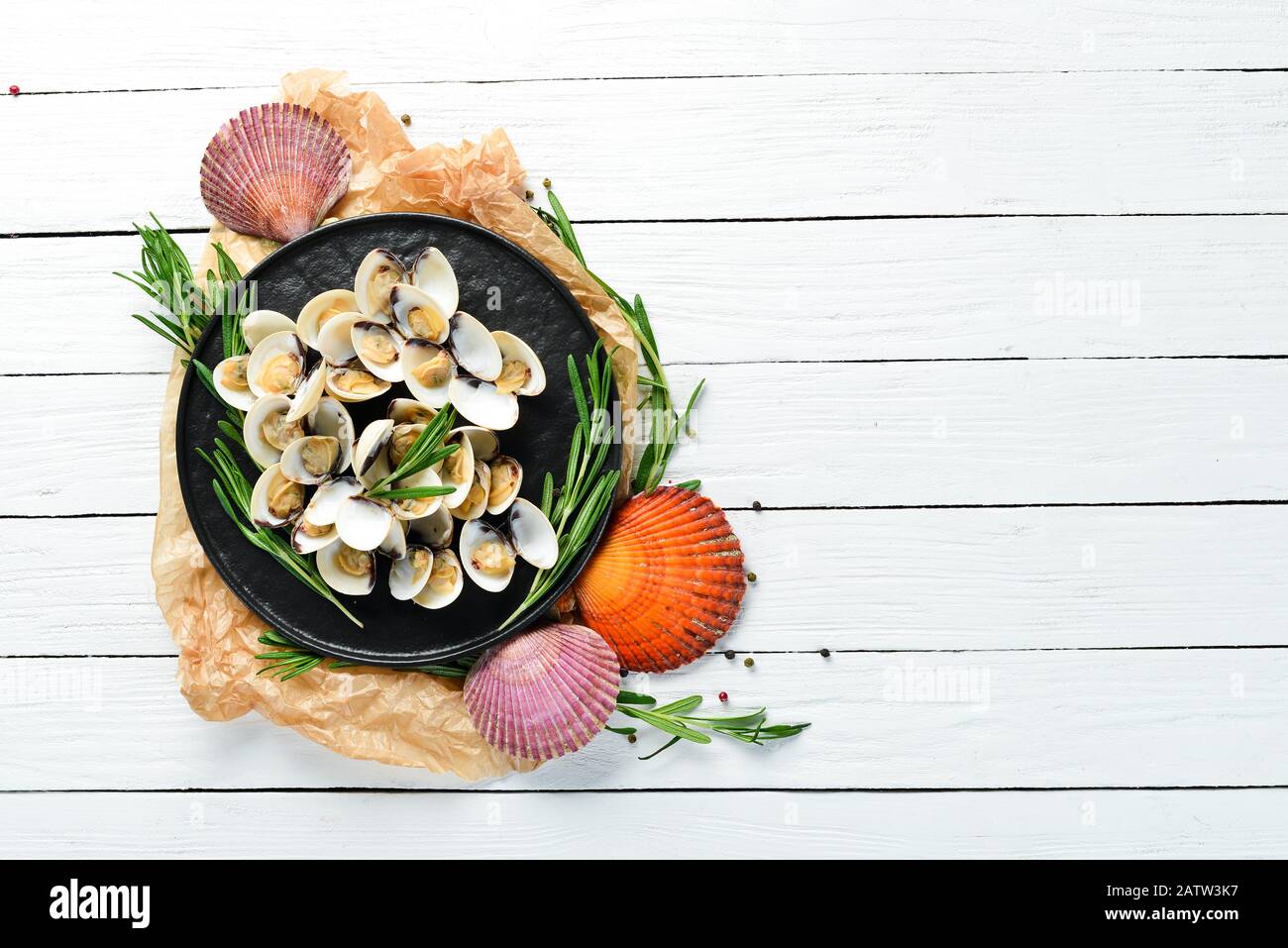 Boiled clams in a plate. Seafood on a white background Stock Photo - Alamy