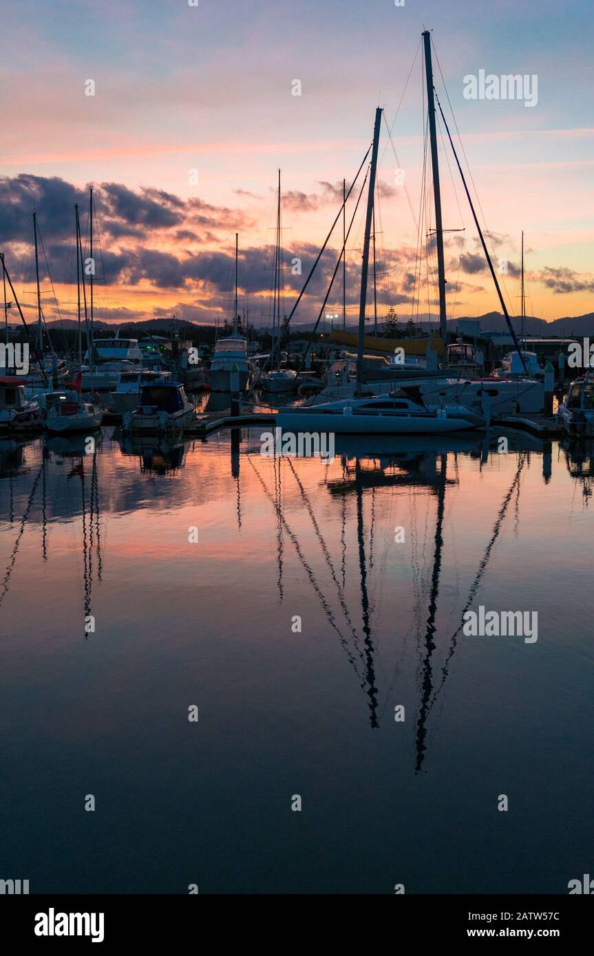 Boats in a bay with beautiful sunset sky on the background and water ...