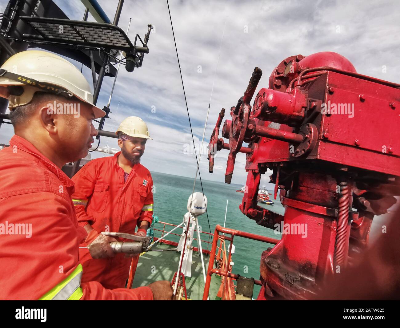 Offshore marine crew doing schedule serviced maintenance and grease at ...