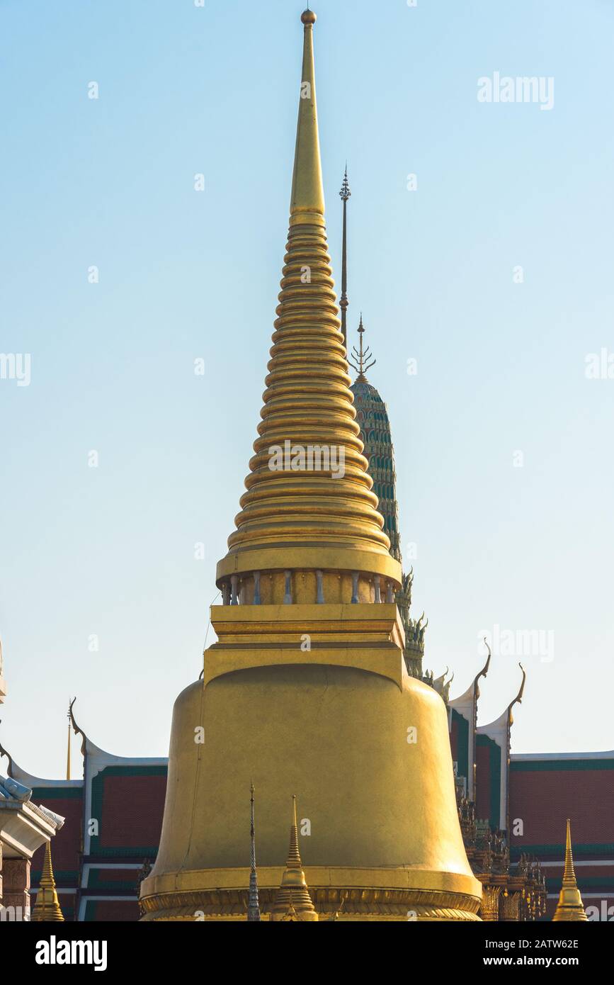 Golden chedi with spire. Traditional Thai religious architecture detail ...