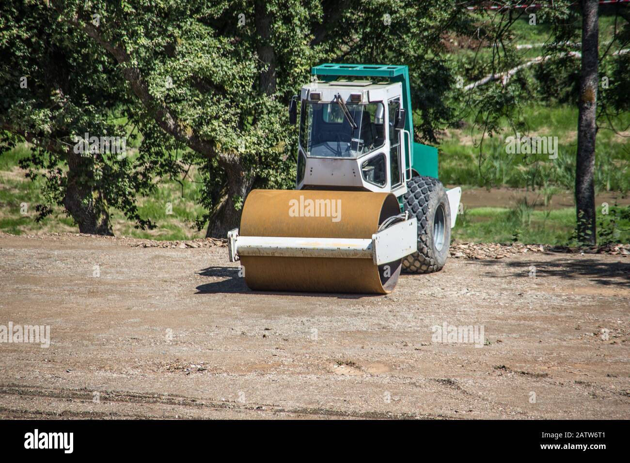 yellow construction machinery on construction site Stock Photo - Alamy