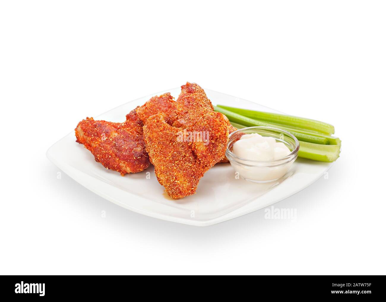 Hot Fried Crispy Chicken Wings in batter on a white plate with celery ...
