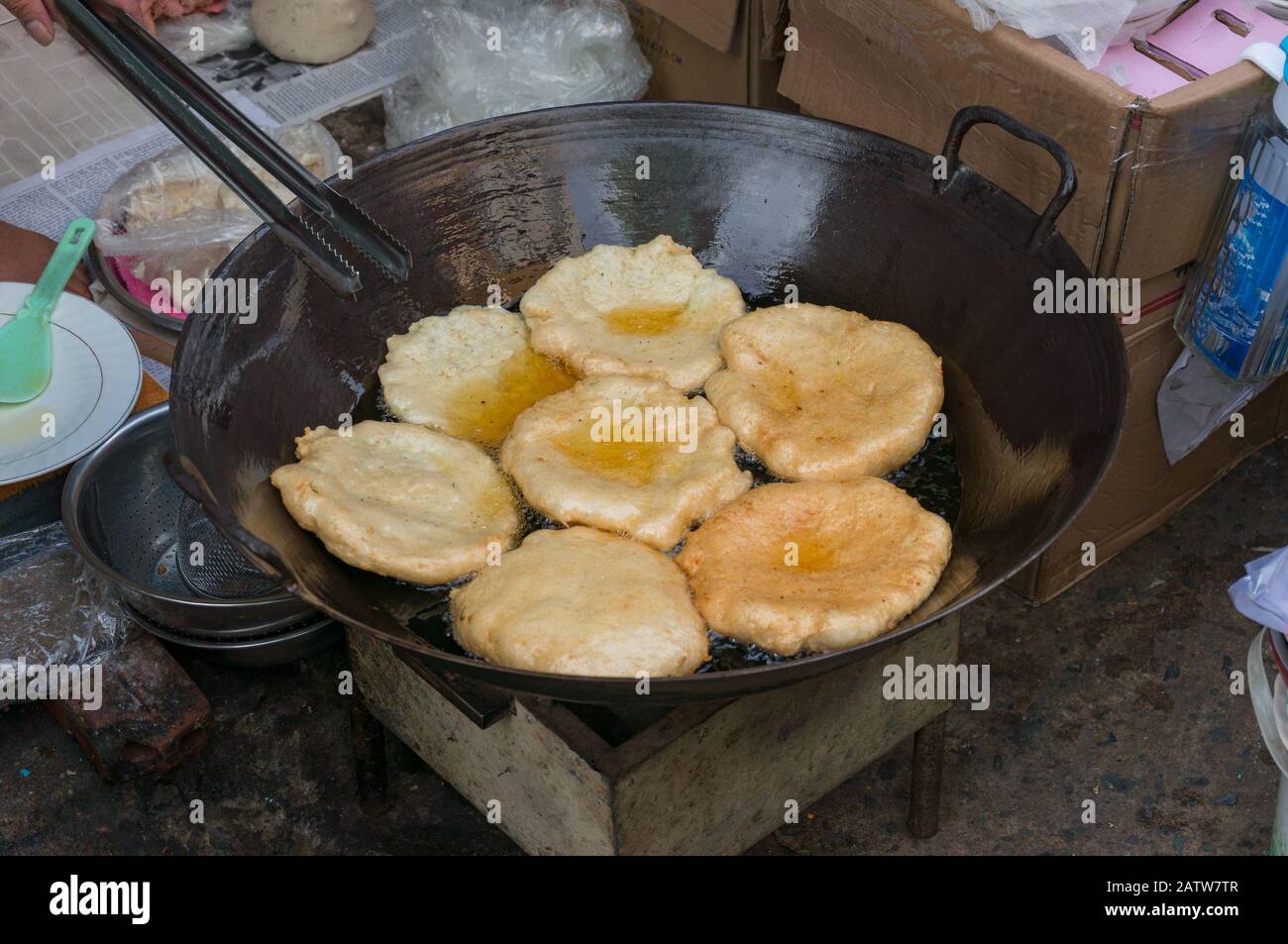 Traditional Vietnamese pastry pancakes deep fried in oil. Street food ...