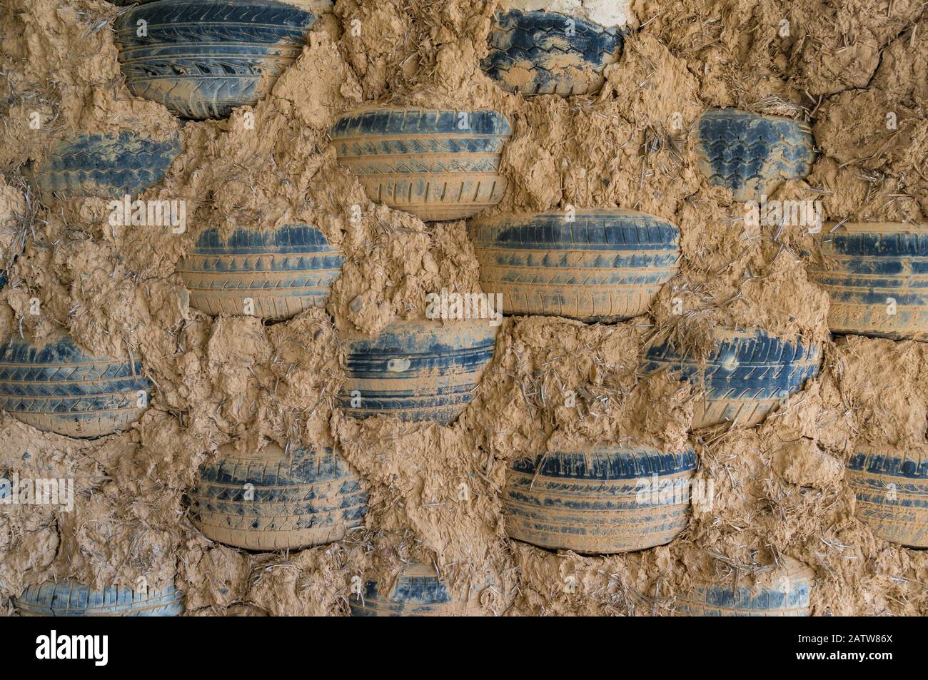 Tire wall background. Sustainable eco construction, eco-building ...