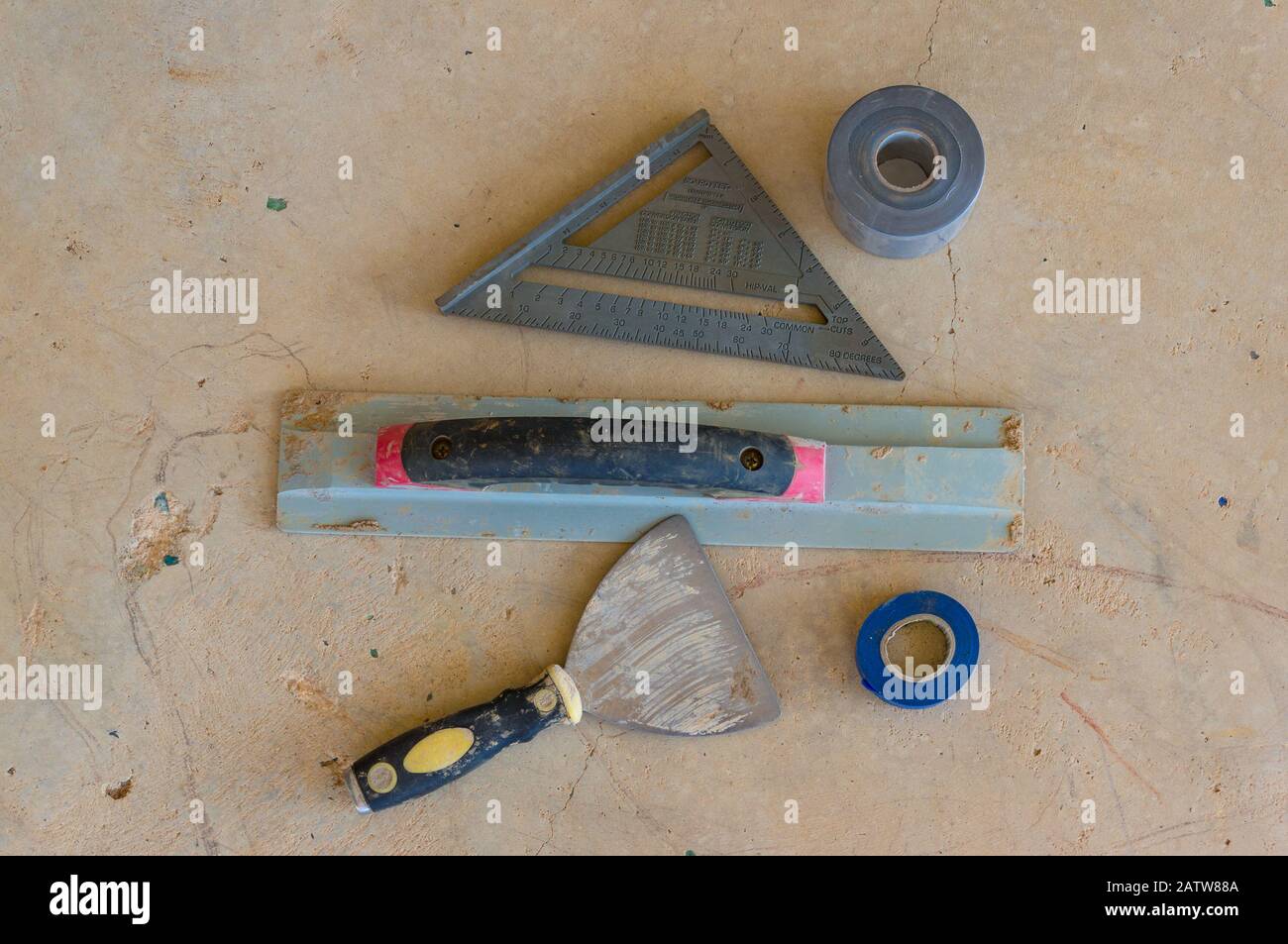 Construction worker tools on concrete floor background. Building ...