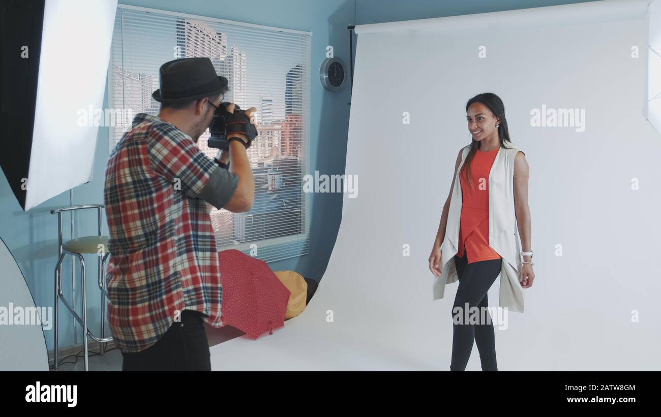 Backstage of photo shoot: multiracial young woman posing for fashion ...