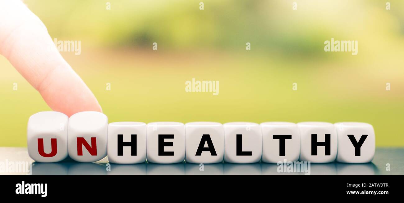 Hand turns dice and changes the word "unhealthy" to "healthy Stock ...