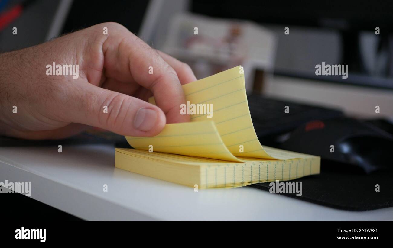 Businessman Browsing Small and Yellow Sticky Notes on Office Desk Stock ...