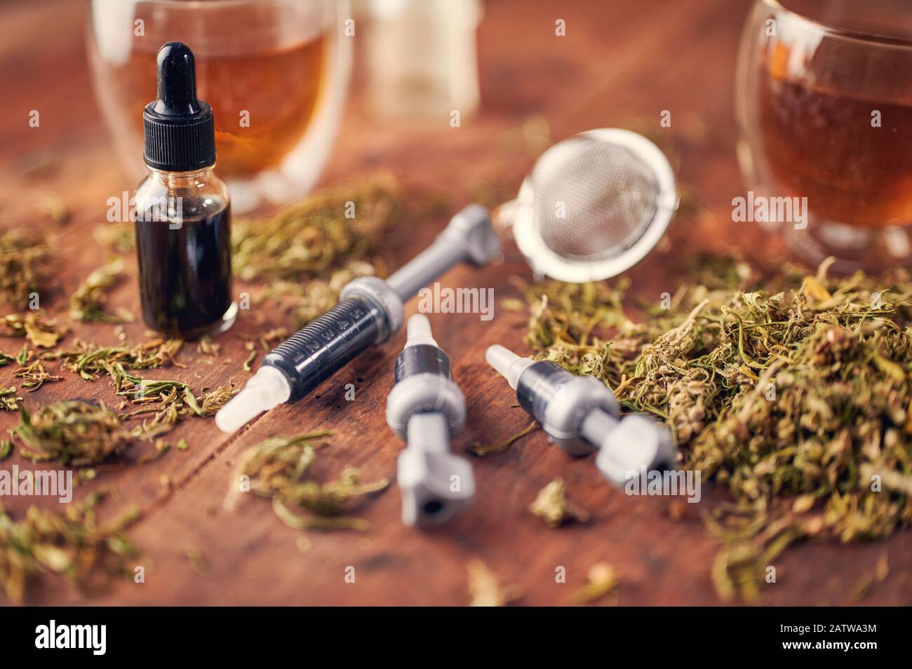 Medical marijuana concept - CBD oil, CBD paste, dried marijuana leaves ...