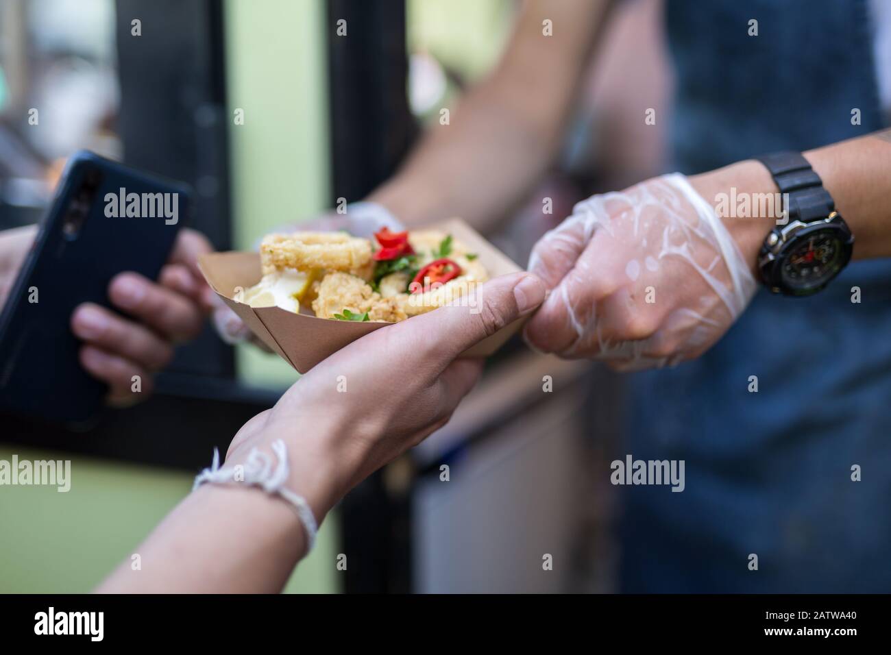 Street Food: Fried Fish, Squids Served in a Small Paperboard Stock ...