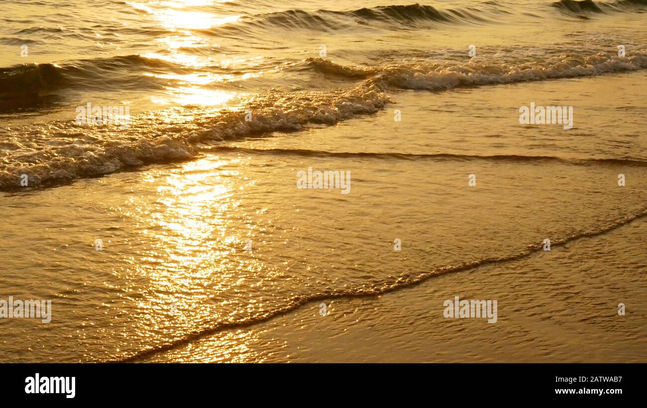 amazing sunset over the tropical beach. ocean beach waves on beach at ...