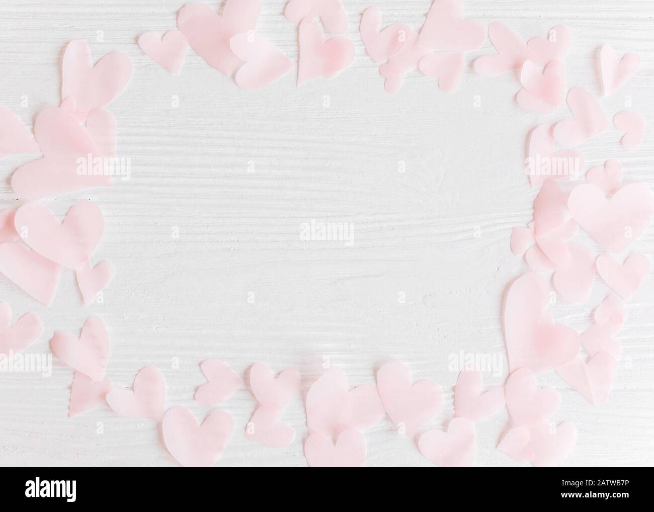 Cute pink hearts on white wooden background with space for text. Flat ...
