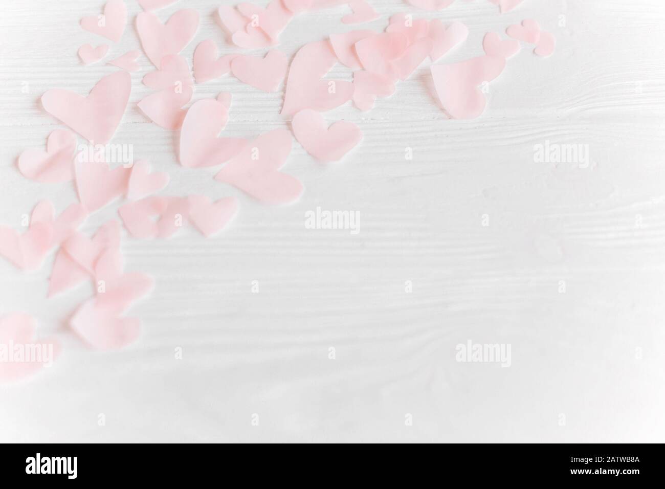 Happy valentines day. Cute pink pastel hearts on white wooden ...