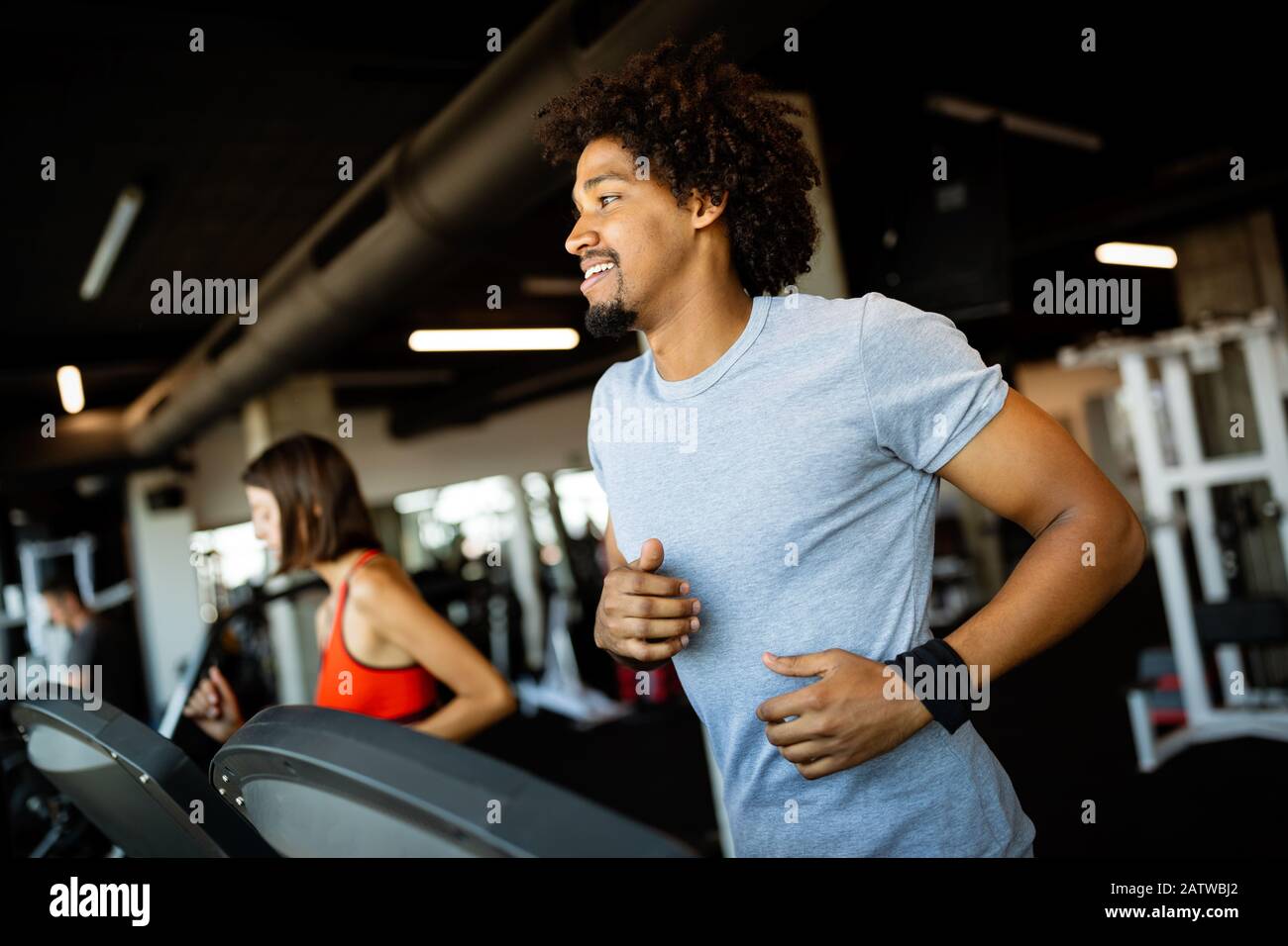 Picture of people running on treadmill in gym Stock Photo - Alamy