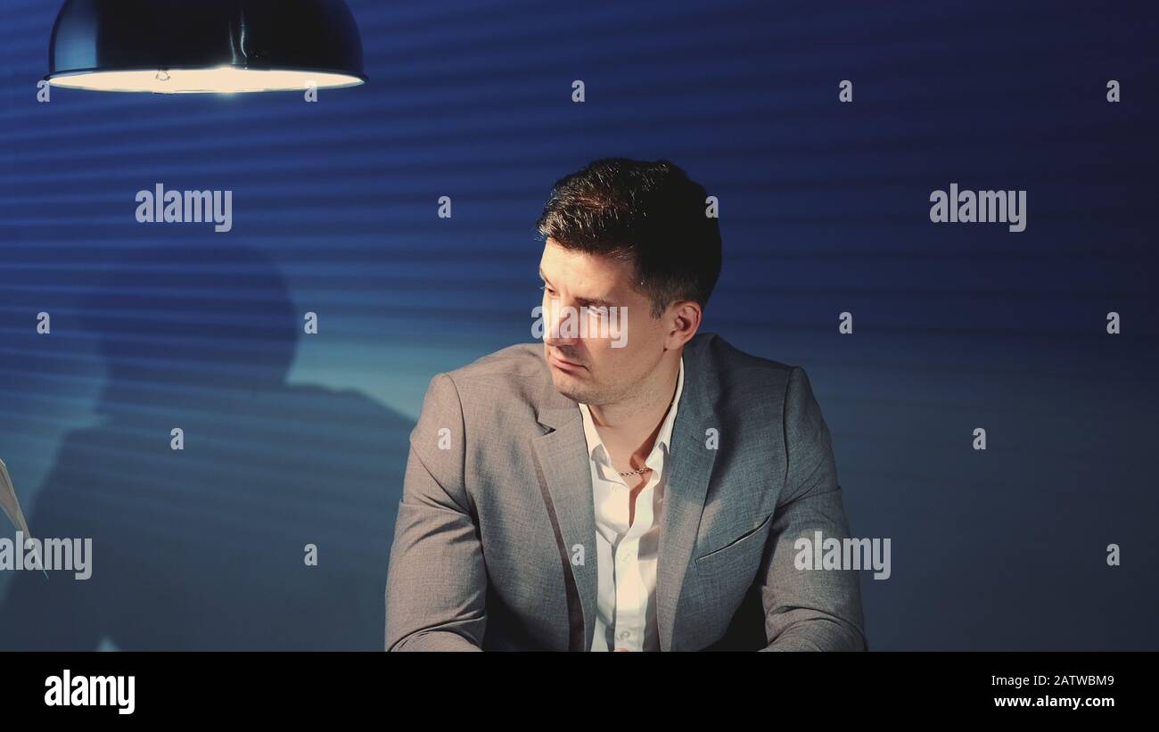 Police detective showing photos of the person, but the suspect criminal ...