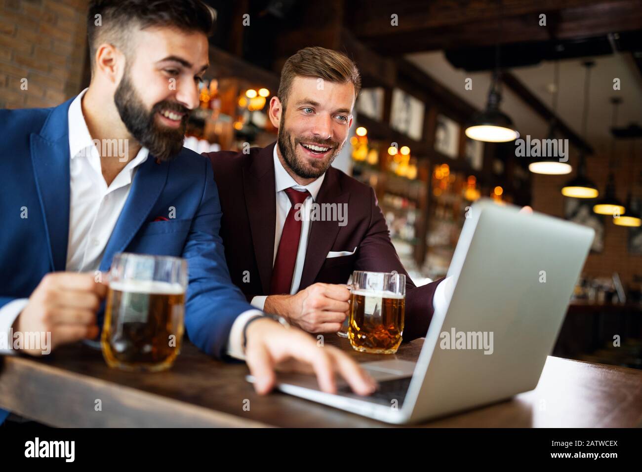 Business people drink beer after work. Businessmen enjoy a beer Stock ...