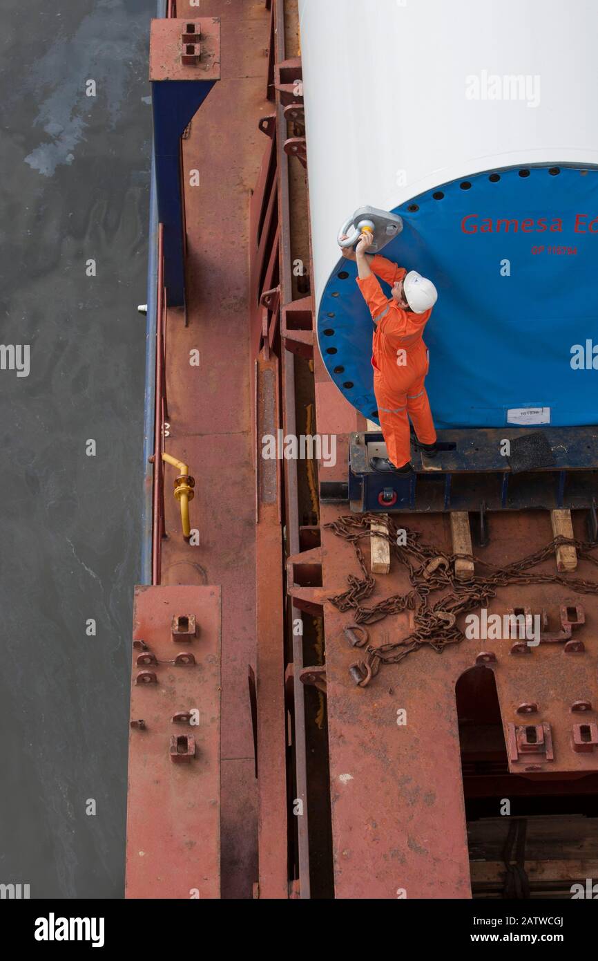 Ship worker checking the loading of goods for export Stock Photo - Alamy