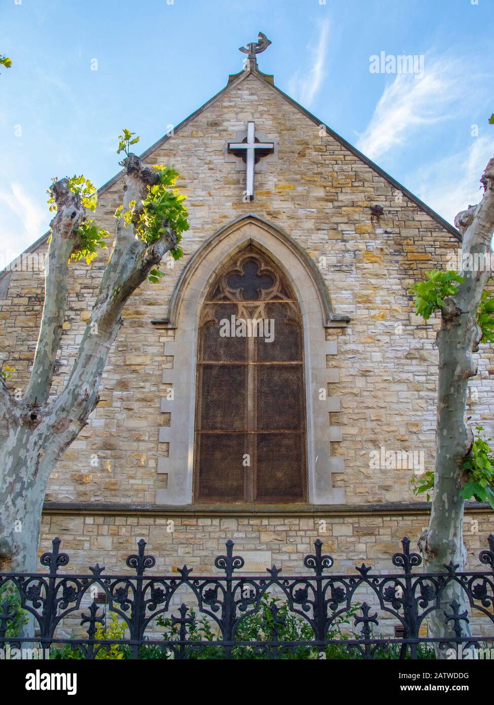 front of the church building, white cross over window arch Stock Photo ...