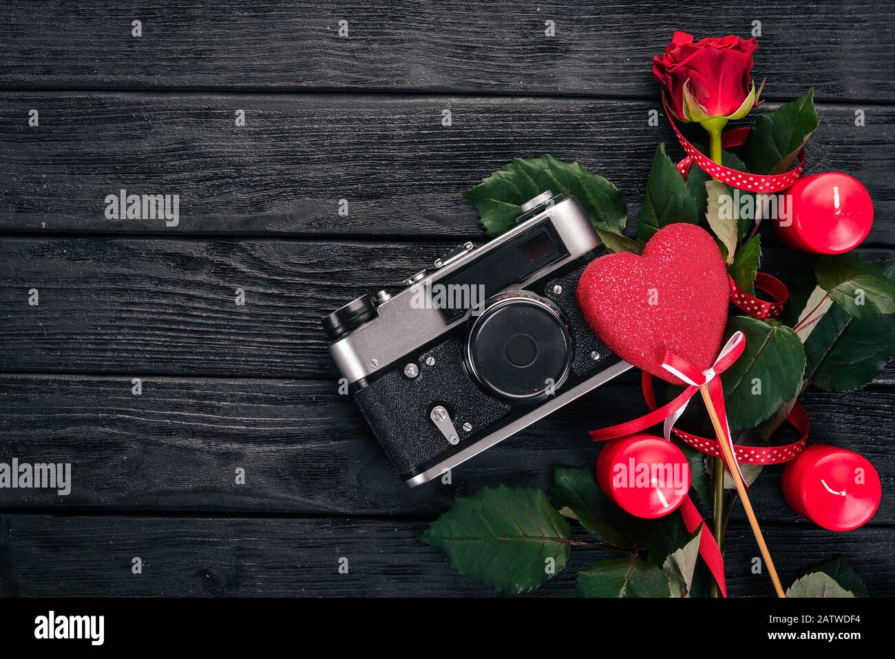Valentines day. Roses, camera, gift. Love. Top view. Free space for ...