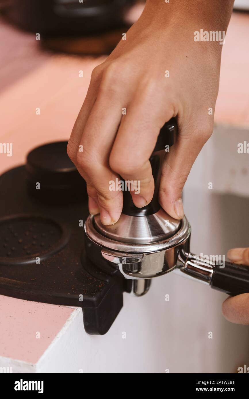 Hand checking coffee powder before put it in the maker Stock Photo - Alamy