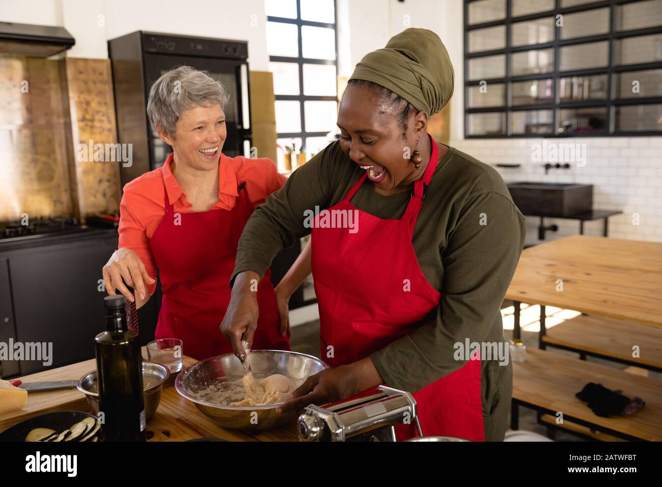 Chefs having fun while cooking Stock Photo - Alamy