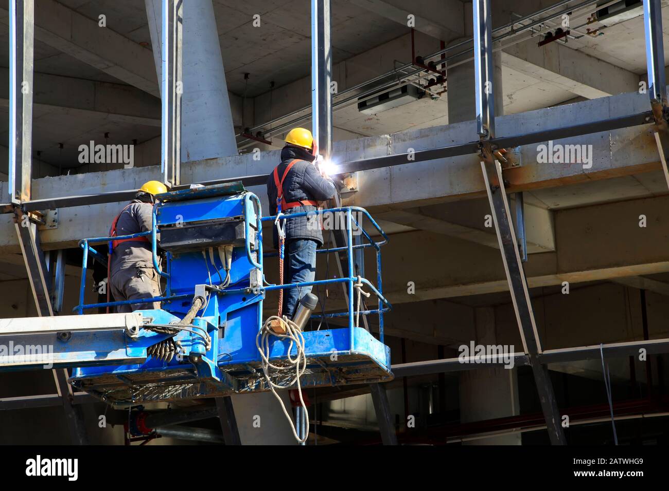 Construction site, the welding workers at work Stock Photo - Alamy