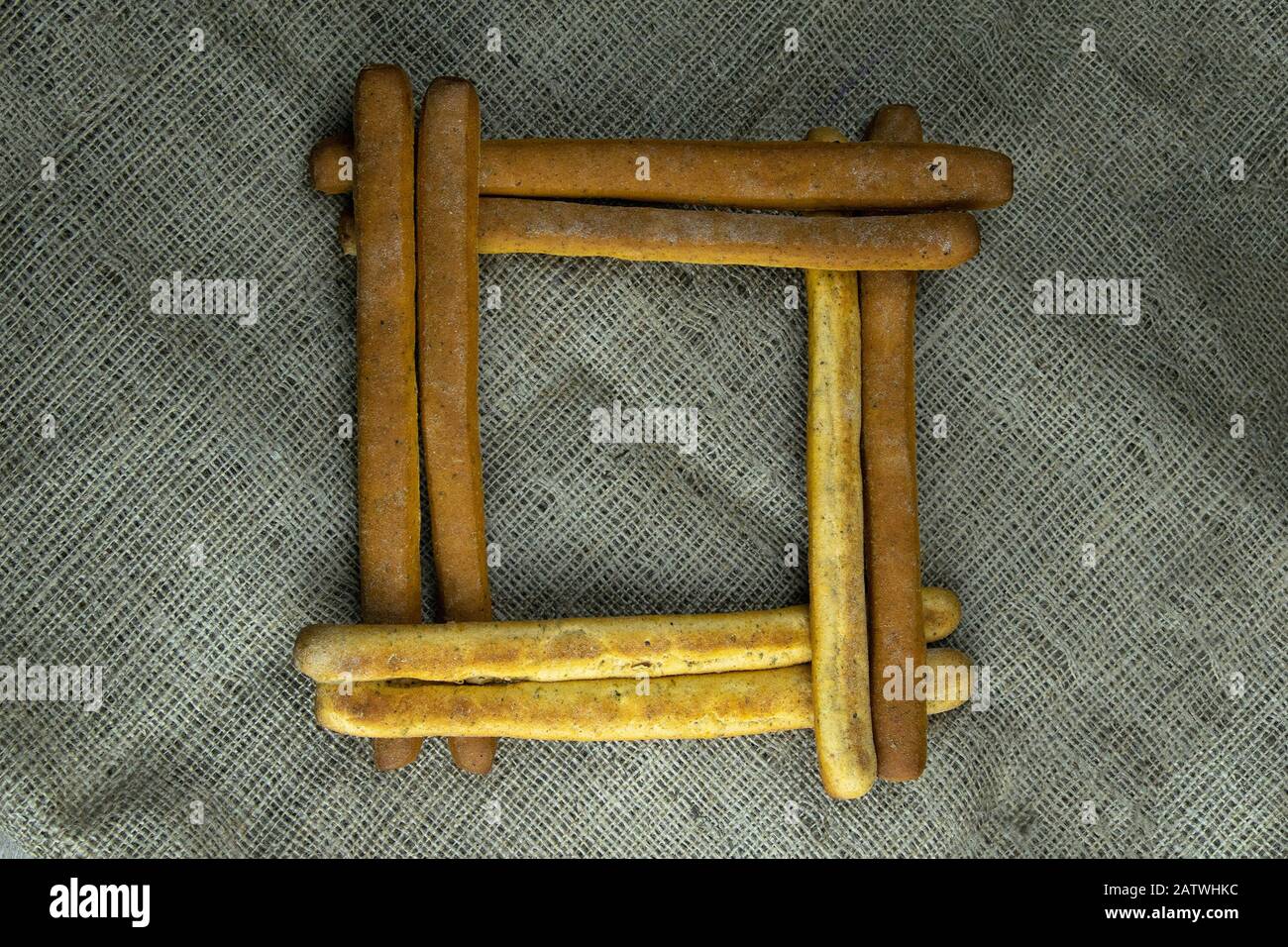 Pile of breadsticks or grissini square shape square view Stock Photo ...