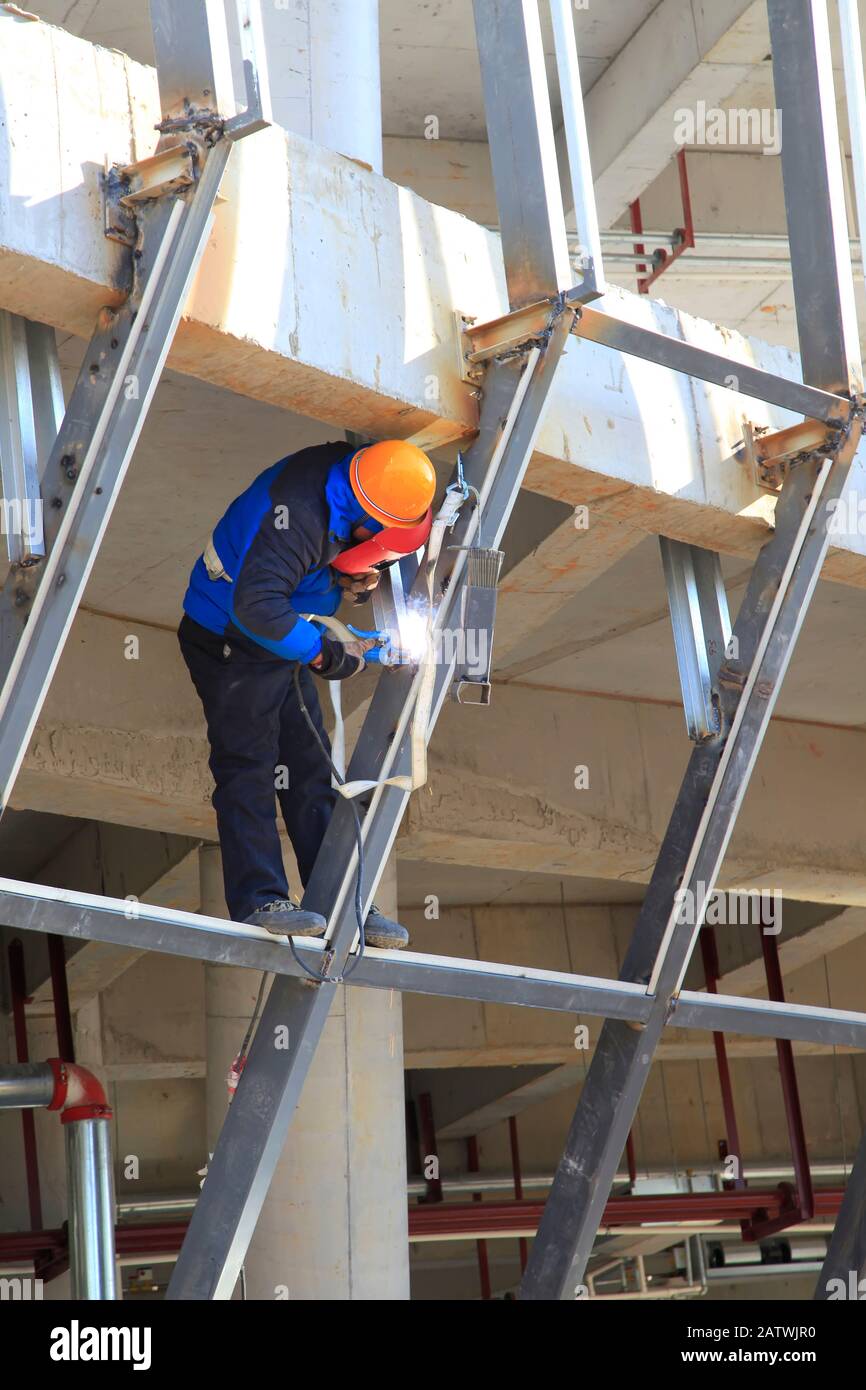 Construction site, the welding workers at work Stock Photo - Alamy