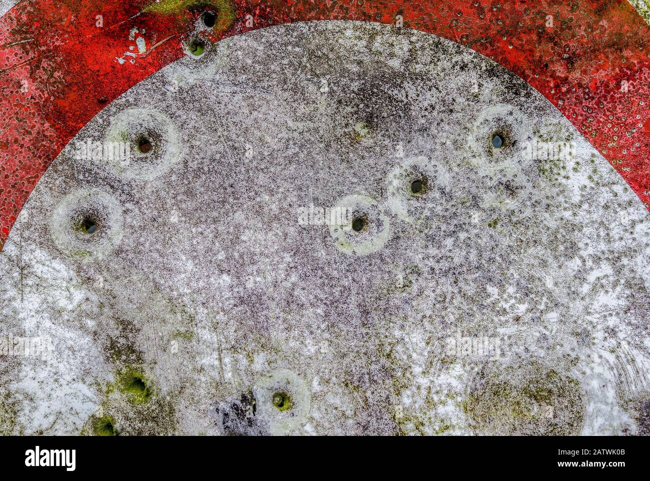 Detailed close up of bullet holes from gun shots in a german traffic ...