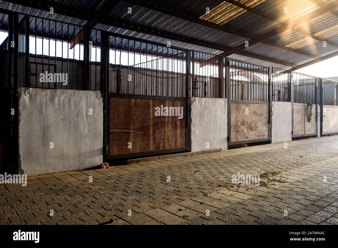 Empty stable with dirty wooden doors on a farm Stock Photo - Alamy