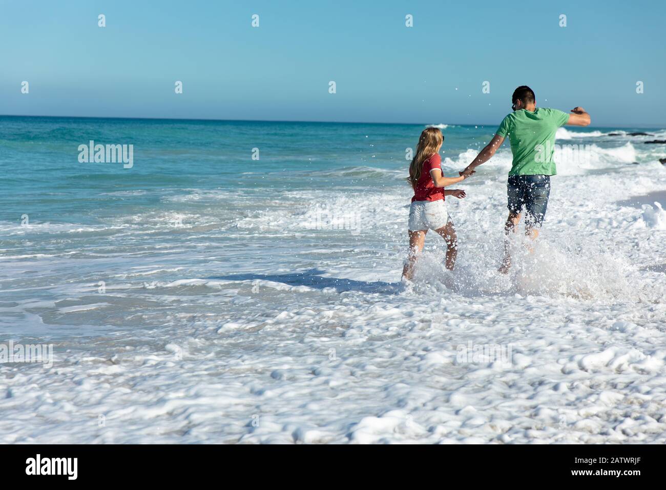 Romantic couple running together in hi-res stock photography and images ...