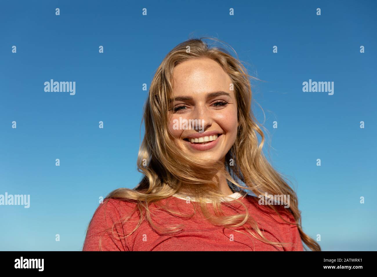 Low view happy young woman Stock Photo - Alamy