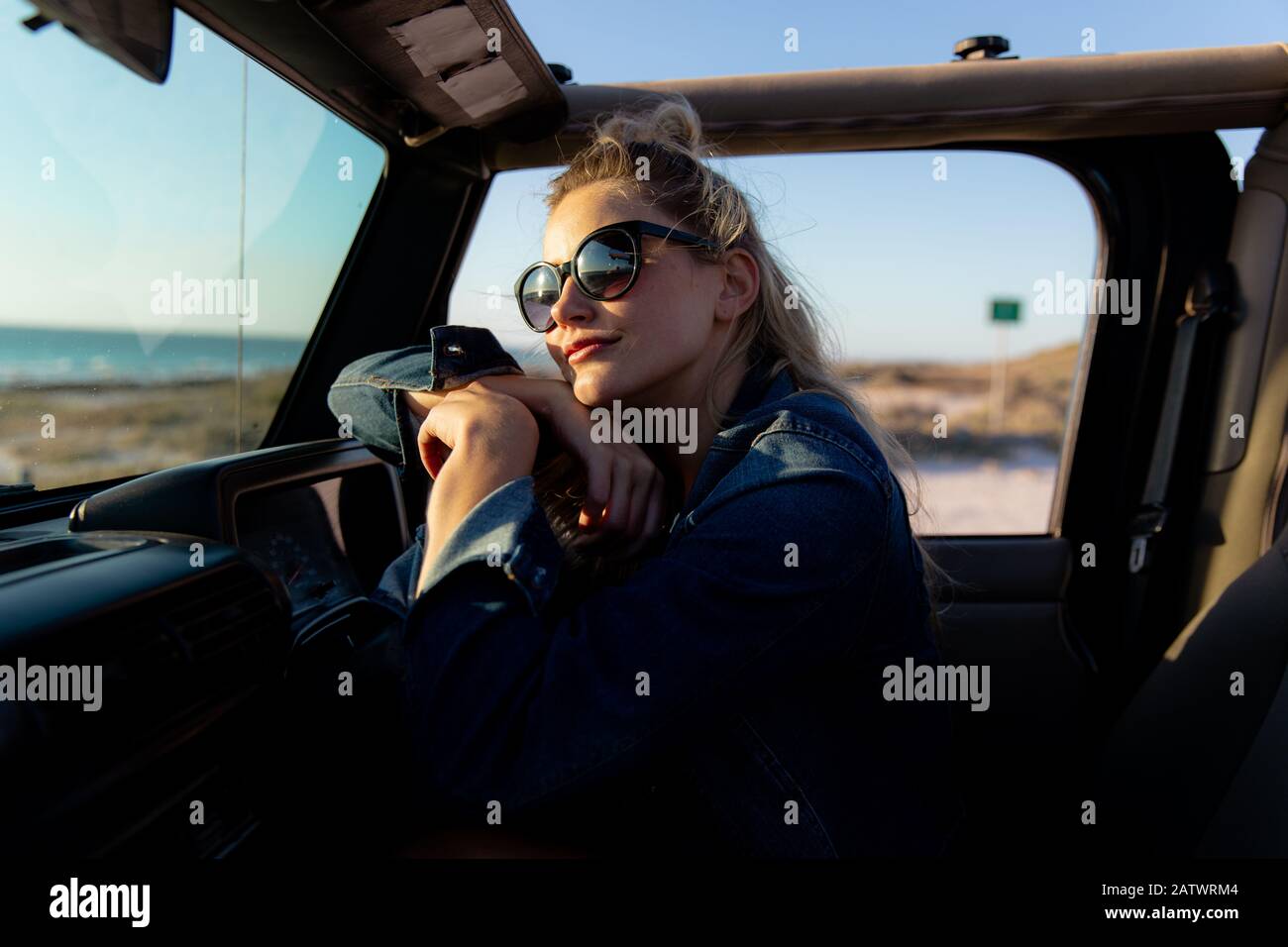 Woman relaxing in a car Stock Photo - Alamy