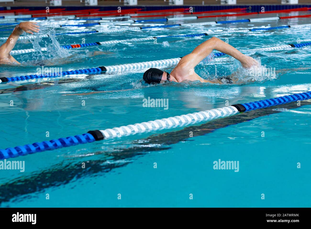 Swimmers racing in pool hi-res stock photography and images - Alamy