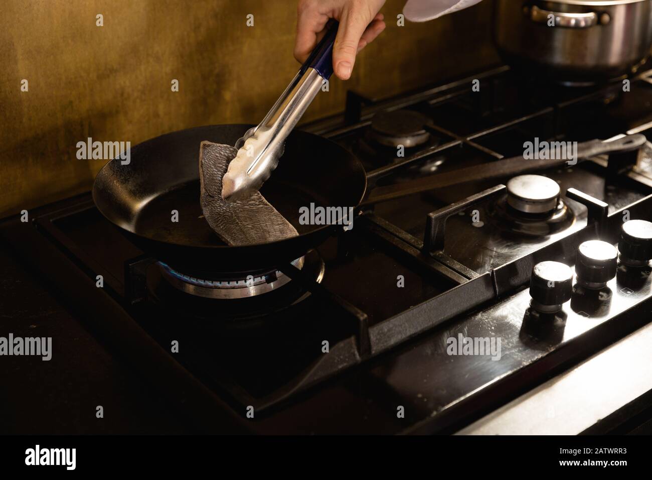 Female cooking fish hi-res stock photography and images - Alamy