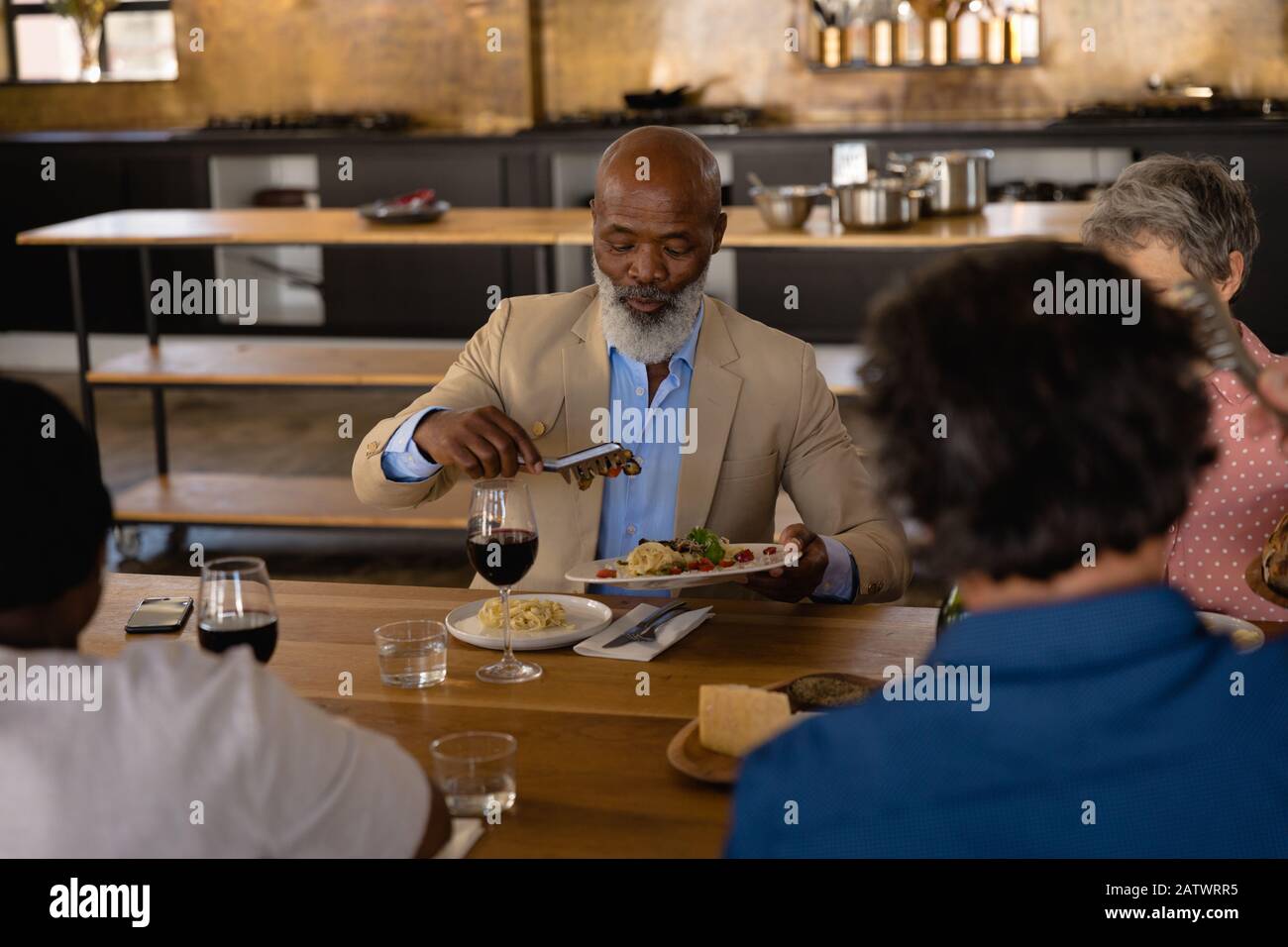 Mature friends eating restaurant hi-res stock photography and images ...