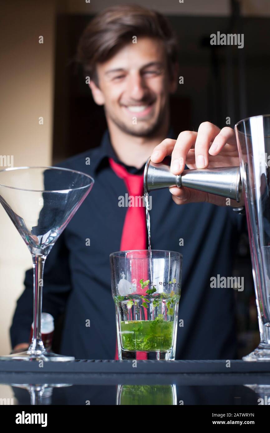 Barman making a cocktail.one man only Stock Photo - Alamy