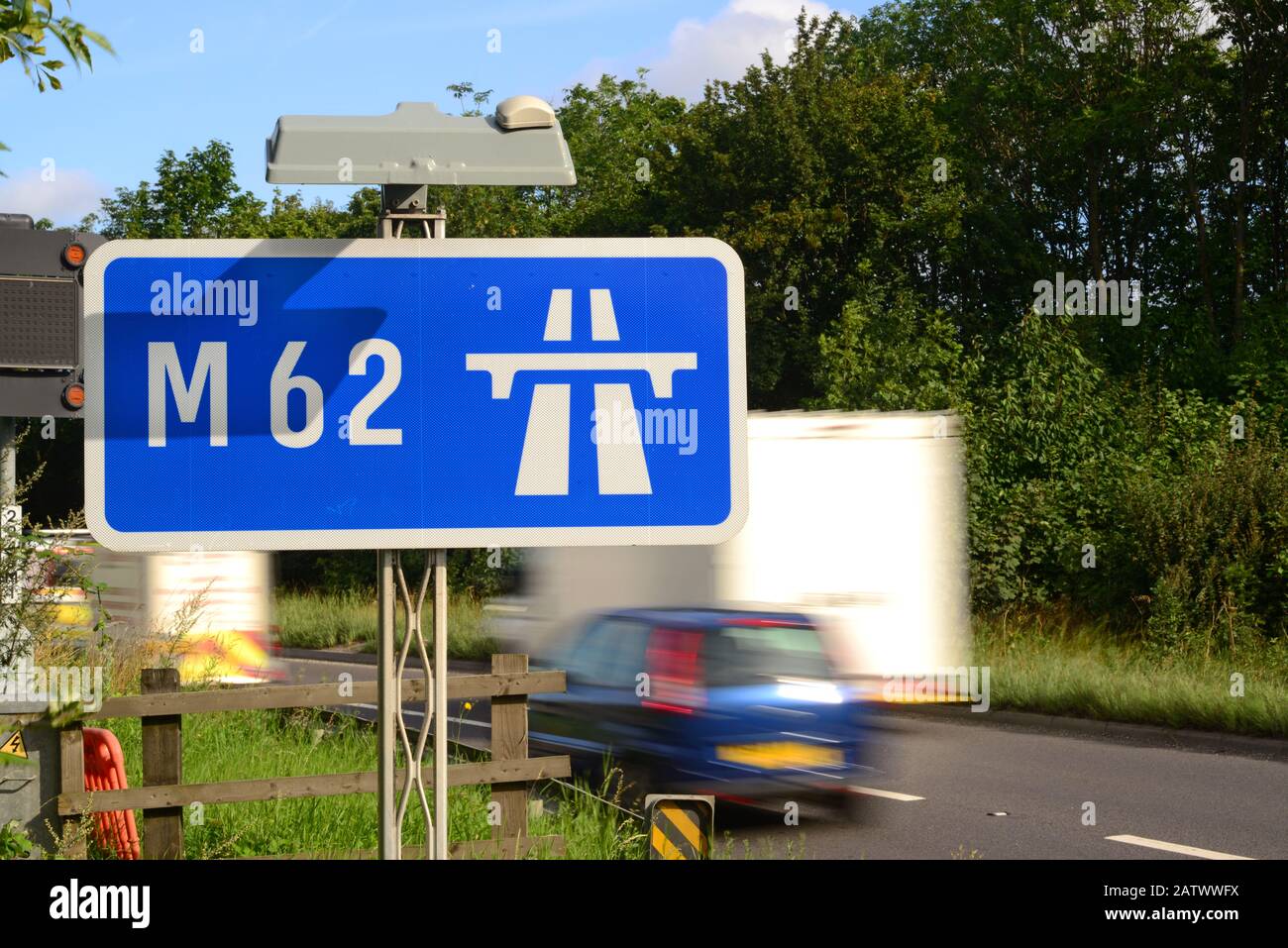 traffic passing m62 motorway sign at normanton junction leeds yorkshire ...