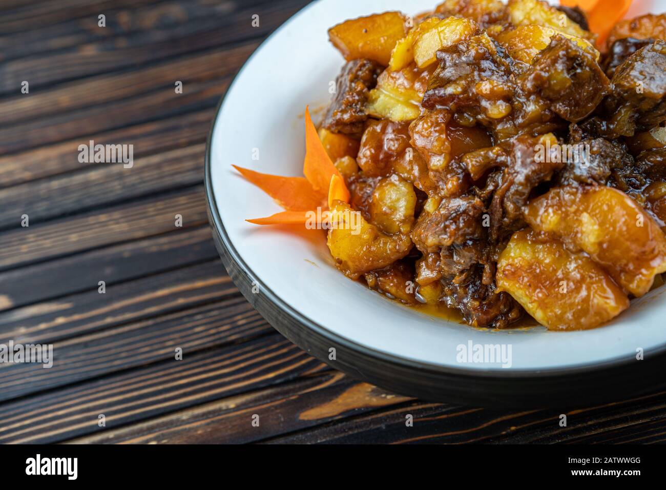 Beef stew with potatoes in a plate Stock Photo - Alamy