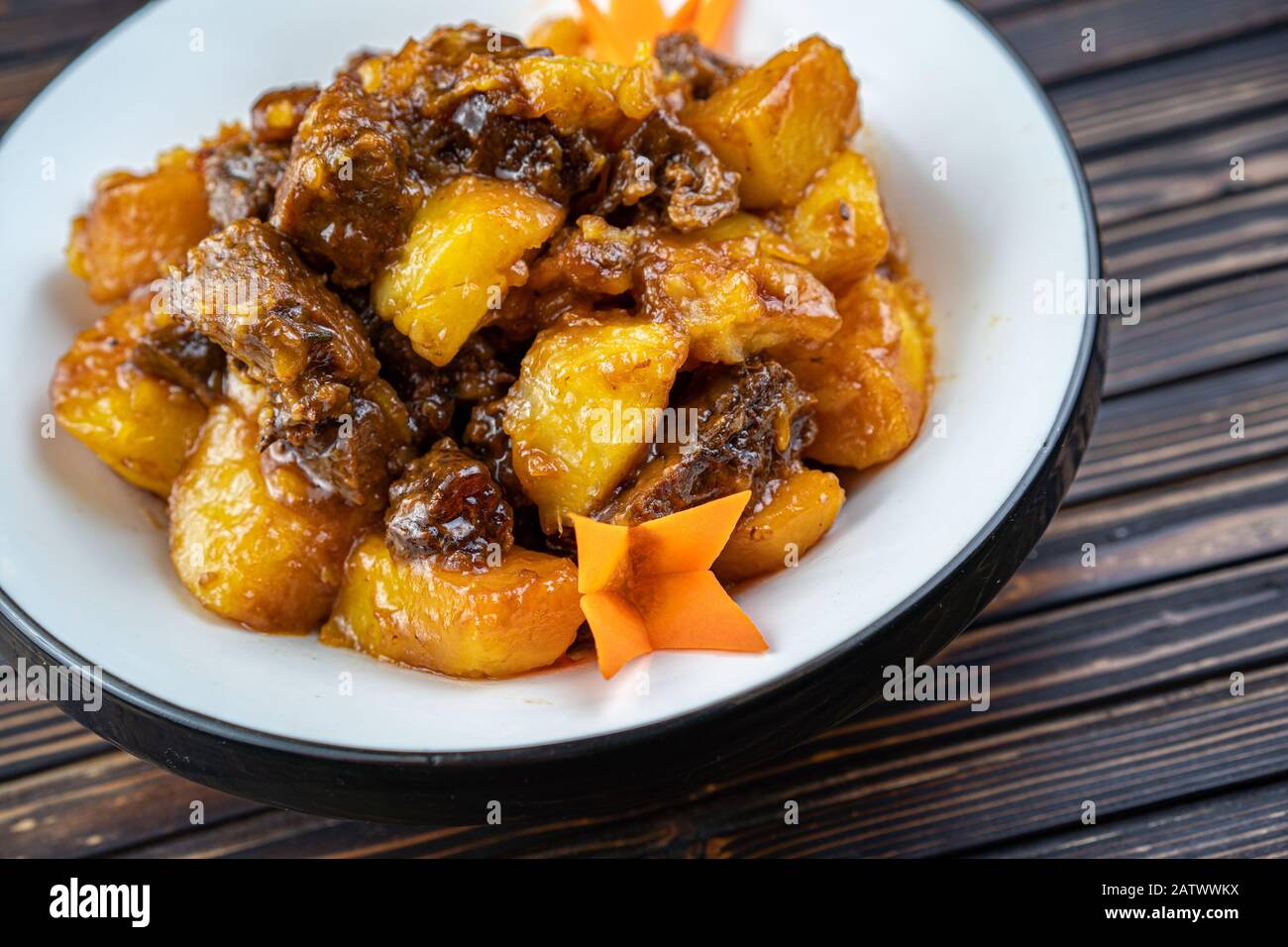 Beef stew with potatoes in a plate Stock Photo - Alamy
