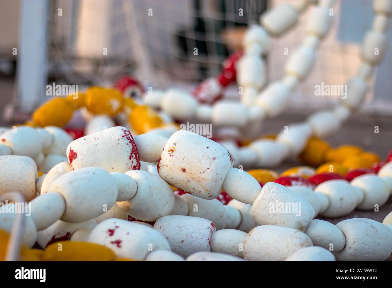 Styrofoam balls tied with a rope , traditional beach barrier ...